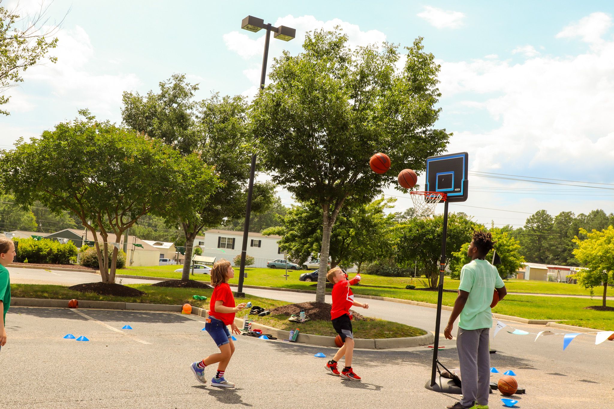 Little Kids Playing Basketball Outside